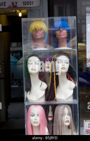 Wigs in Store Window Stock Photo - Alamy