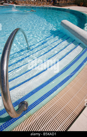 steps to get into the pool with the sea background Stock Photo - Alamy
