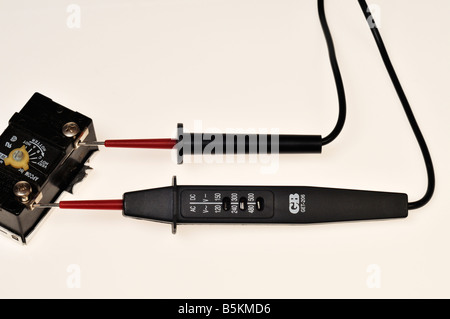 Electric AC power tester with probes on white background Stock Photo ...