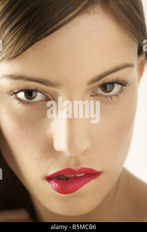 woman face biting lip pain fear apprehension Stock Photo - Alamy