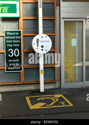 Help point sign at railway station Stock Photo - Alamy