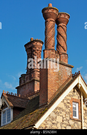 Ornate brickwork Pugin chimneys on a house in Albury, Surrey Stock ...