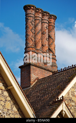 Ornate brickwork Pugin chimneys on a house in Albury, Surrey Stock ...