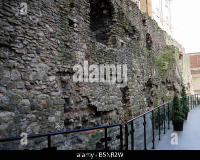 Part of the ancient city wall of London, UK. A medieval wall with the ...