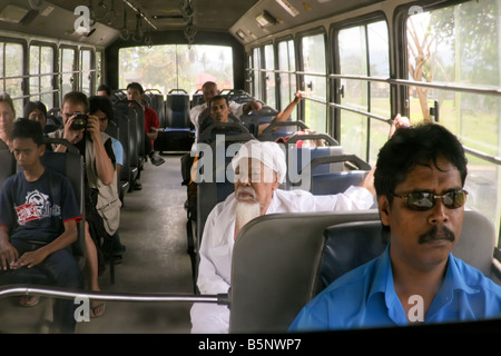 Bus driver with passengers Stock Photo - Alamy