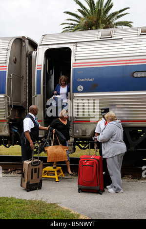 Amtrak railroad conductor alights passenger train railroad America USA ...