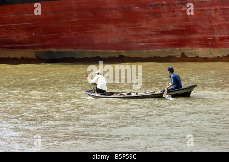 two red rowboat near the river Stock Photo - Alamy
