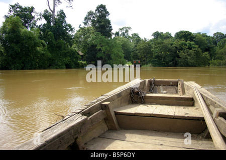 into a rowboat, the dai nai river at monsoon time in the nam cat tien ...
