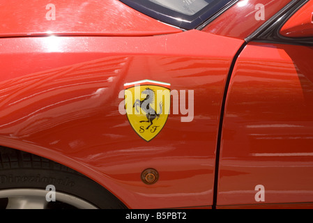 Black Ferrari car side. Ferrari badge horse logo Stock Photo - Alamy