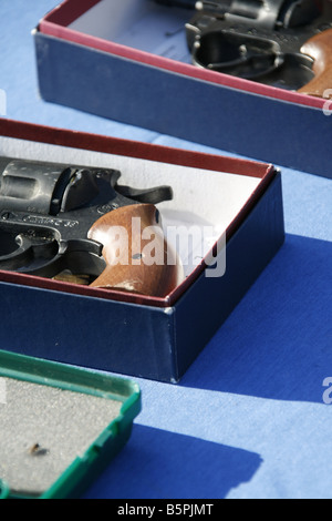 two pistols guns revolvers on blue table Stock Photo - Alamy