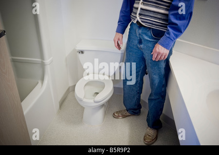 Man Standing Up Urinating In A Toilet With The Seat Up Stock Photo - Alamy