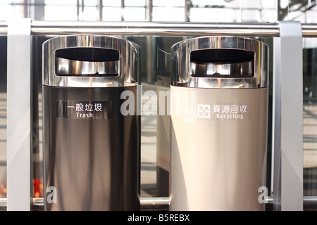 Trash can and recycle bin with bilingual signs on them Stock Photo - Alamy