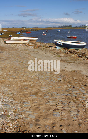 Old quayside at Sunderland Point with boats hauled up in background ...
