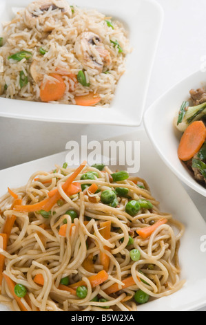 Tasty rice noodles in bowl and chopsticks on red table, closeup Stock ...