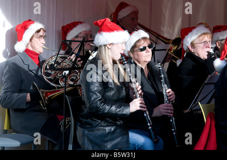 Group of musicians playing in red neon lights at music studio Stock ...