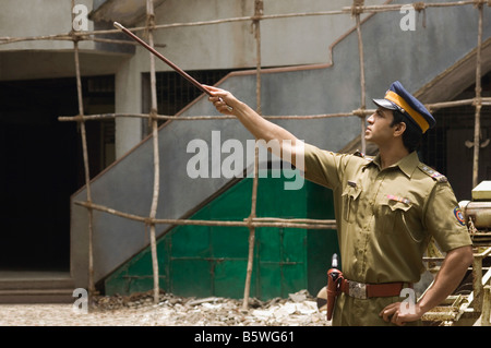 Angry looking police officer pointing his finger at you Isolated on ...