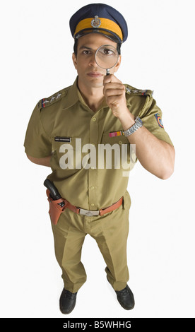 Indian police officer looking at camera Stock Photo - Alamy