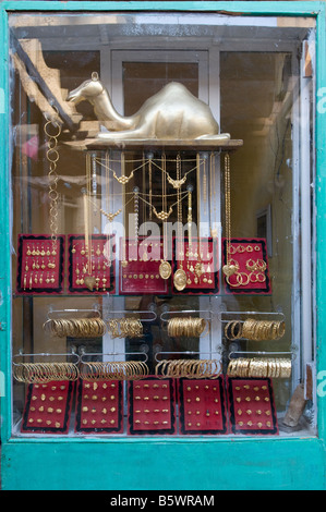 Gold jewelry is displayed at a store in Fuyang City, east China's Anhui ...