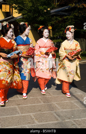 Group of women dressed as Maikos in the streets of Kyoto, Japan Stock ...