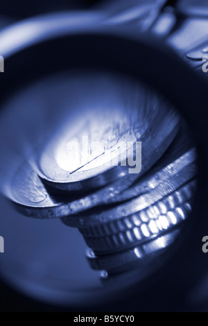 Euro symbol under magnifying glass, on pink background Stock Photo - Alamy