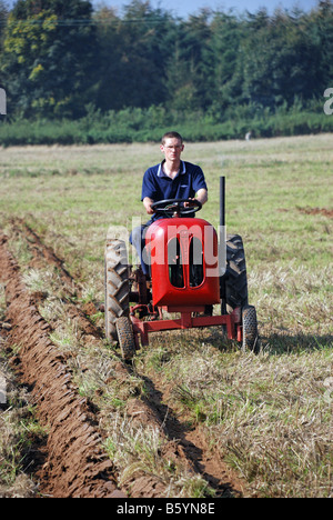 BMB Plowmate vintage sit on tractor and plough at the Surrey County ...