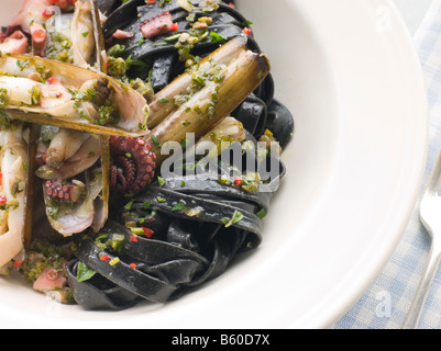 Sauteed octopus with pasta and cheese Stock Photo - Alamy
