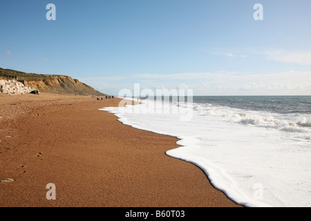 Wash from waves rolling onto the shore of Chesil Beach at Burton ...
