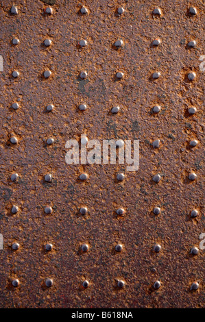 rusted metal plate structure with rivets Stock Photo - Alamy
