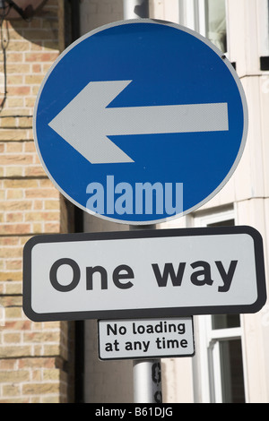 One Way Highway Code sign (blue circle with white arrow) for road users ...