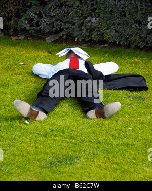 Tiredness businessman sleeping in suit with bag and mobile on hand ...