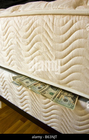 Cash under a mattress Stock Photo - Alamy
