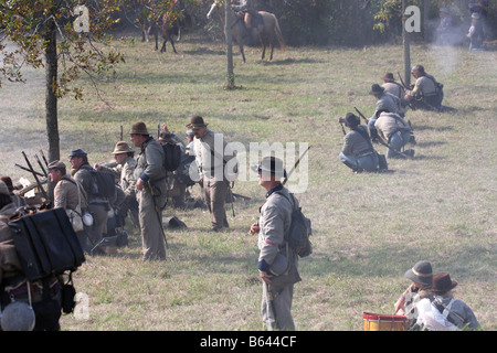 Confederate front line soldiers in battle in the Civil War reenactment ...