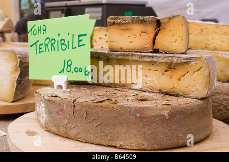 Very ripe cheeses at the festival market in Dogliani CN Piemonte Italy ...