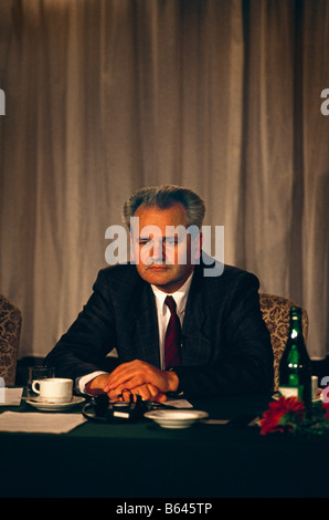 Serbian dictator and President Slobodan Milosevic (on left) sits beside ...