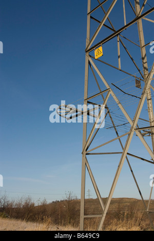 Detail shot of warning sign and barbed wire to prevent unauthorised ...