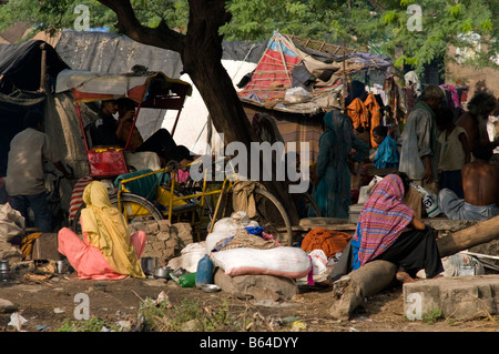 Crowds of people living in slums under the bridge by the Delhi to ...