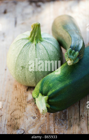 Fresh zucchini squashes on color background Stock Photo - Alamy