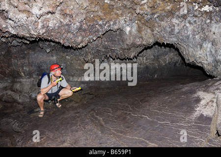 Tourist in lava cave, Gruta das Torres, Pico Island, Azores, Portugal ...