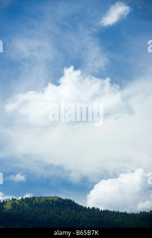 A beautiful cloudscape over rolling hills ay daytime Stock Photo - Alamy