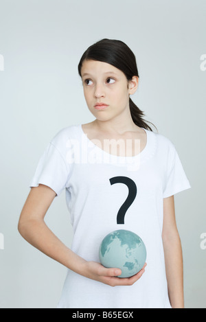 Portrait of a girl with dark hair holds a pink huge protea, selective ...