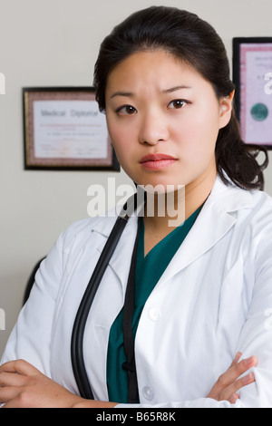 Asian woman medical professional teaching anatomy using laptop for ...