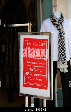 Sale sign notice into a clothes store. Shopping mall advertisement ...