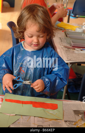 Child using Blue Scissors Stock Photo - Alamy