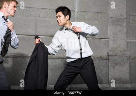 two businessmen fighting Stock Photo - Alamy