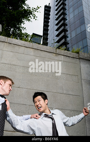 two businessmen fighting Stock Photo - Alamy