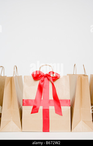 Gift container with tied bow on blue background holidays concept Stock ...