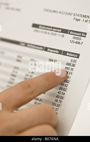 A man holding a bank statement Stock Photo - Alamy