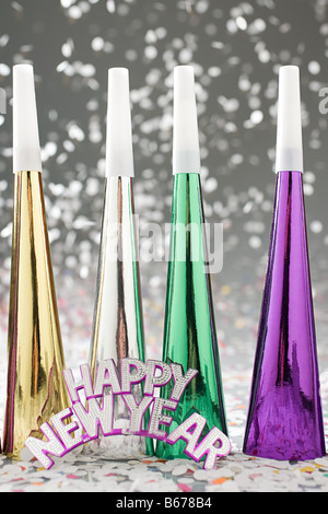 Studio shot of party blowers and confetti Stock Photo - Alamy