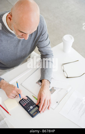 Man pushing desk Stock Photo - Alamy