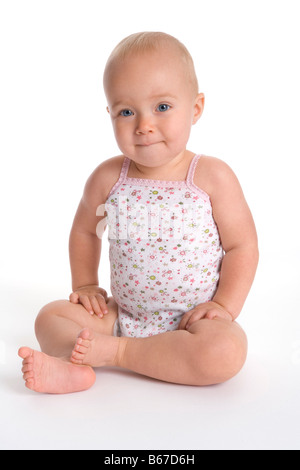 child sitting W posture on the floor Stock Photo - Alamy